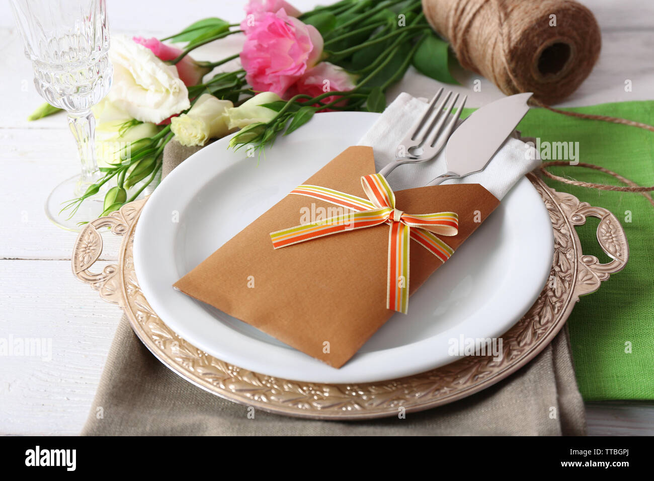 Table setting with spring flowers, close-up Stock Photo - Alamy