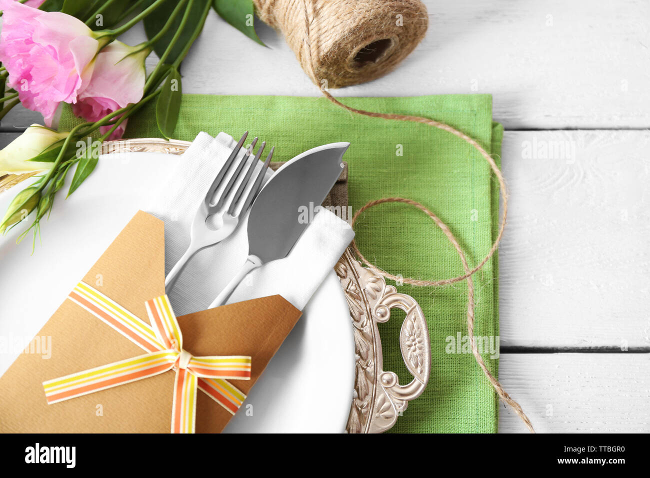 Table setting with spring flowers, close-up Stock Photo - Alamy