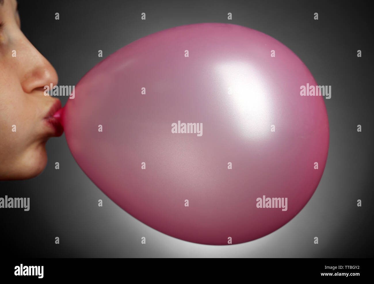 Woman inflating balloon hi-res stock photography and images - Alamy