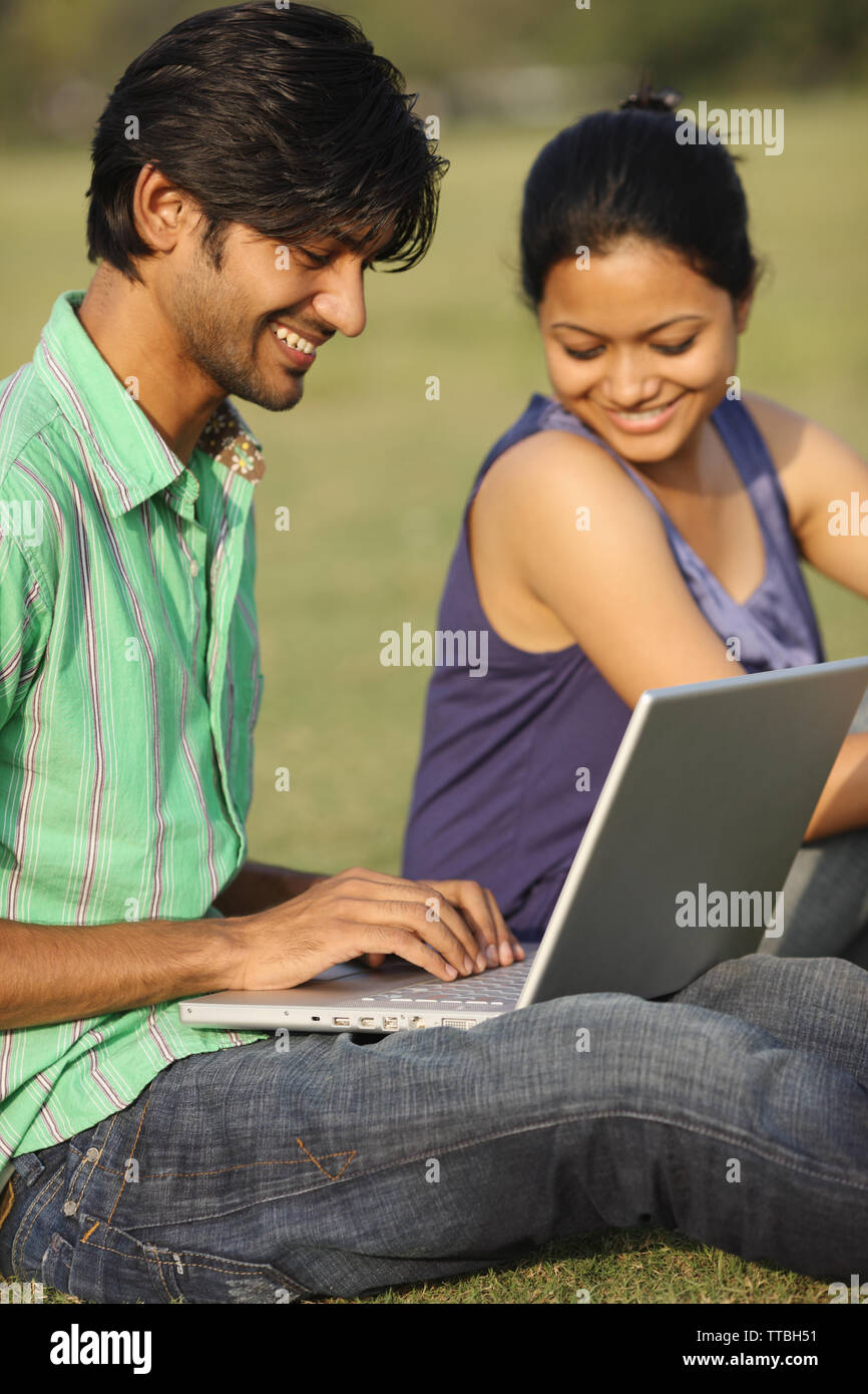 College students studying on a laptop Stock Photo - Alamy
