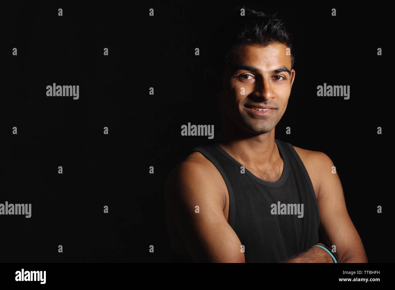Portrait of an Indian young man smiling Stock Photo - Alamy
