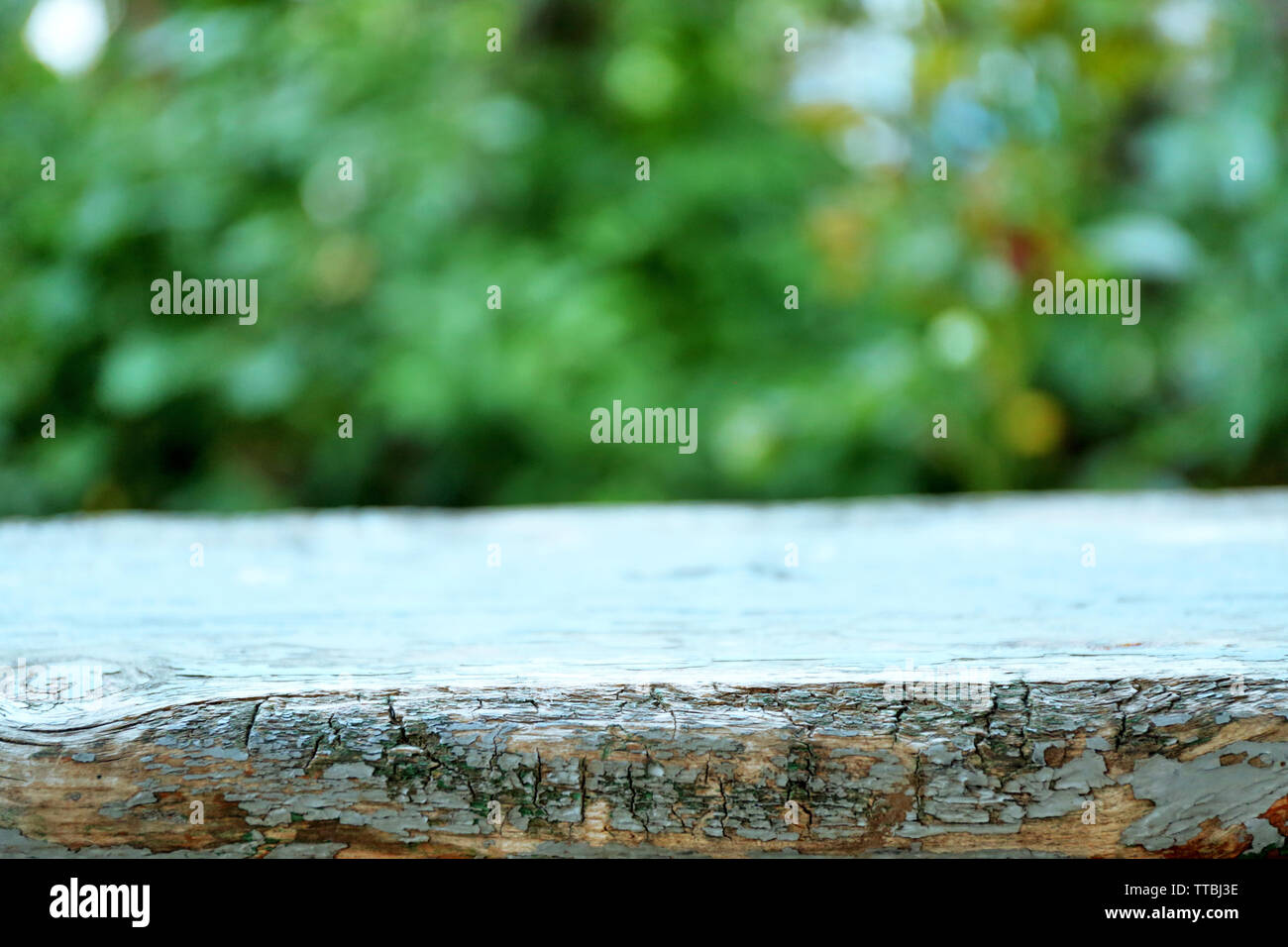Wooden board on nature background Stock Photo - Alamy