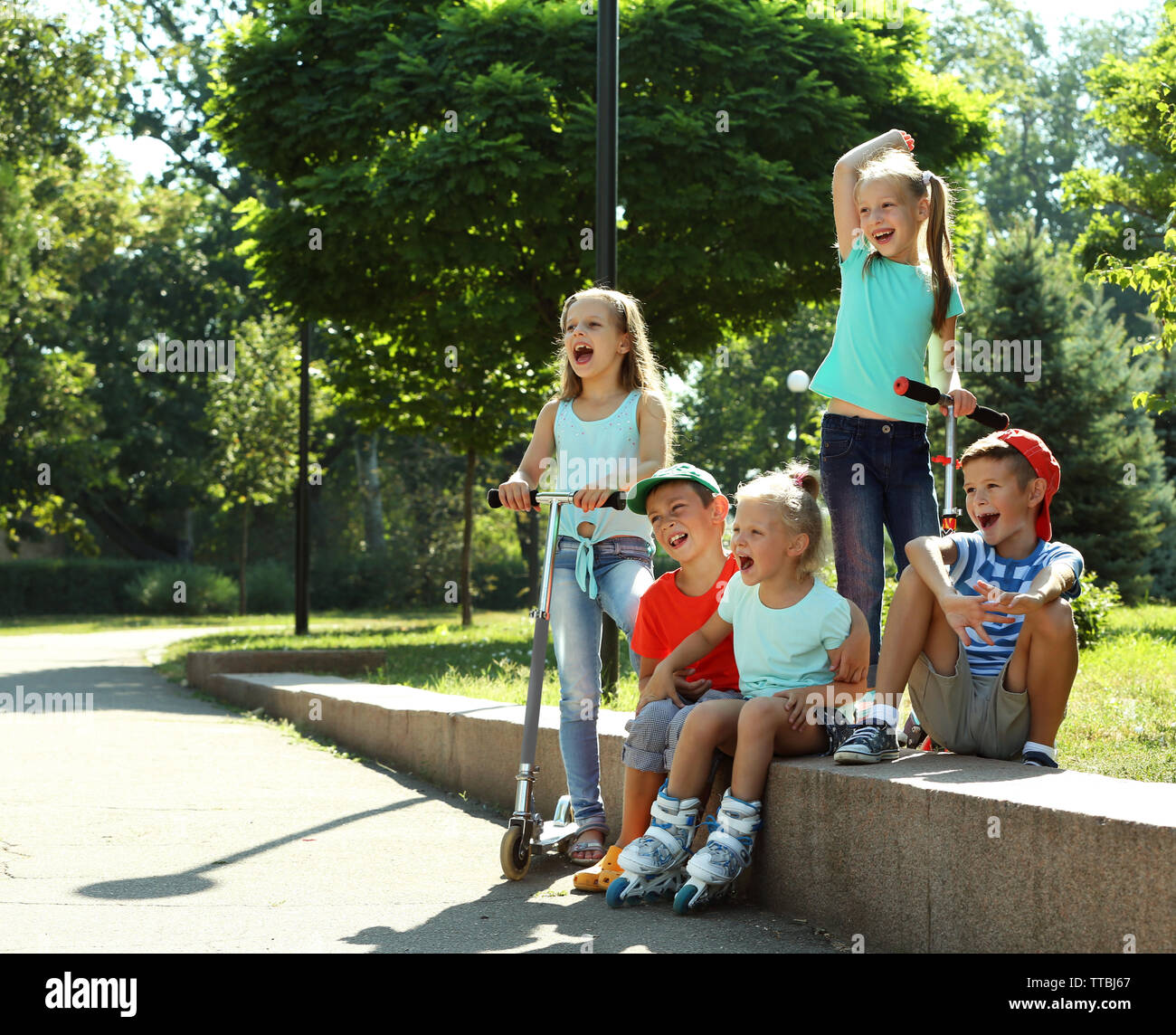 Happy active children in park Stock Photo - Alamy