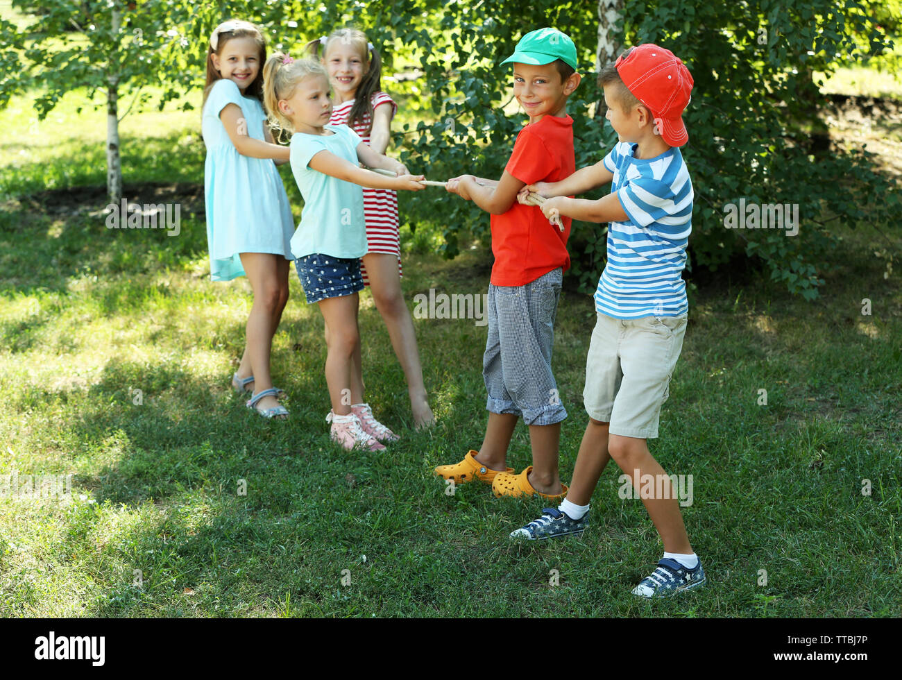 Happy active children playing in park Stock Photo - Alamy
