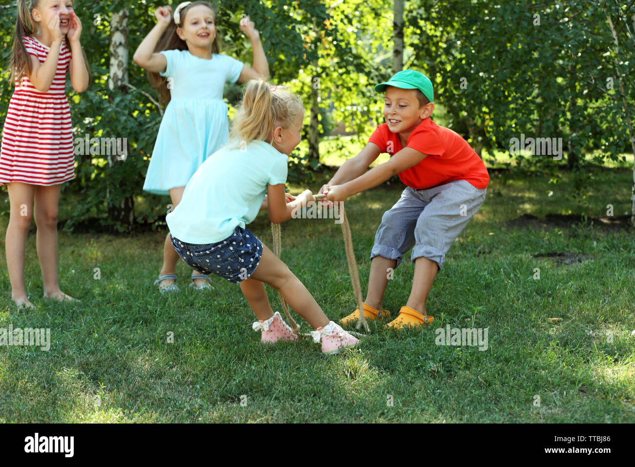 Happy active children playing in park Stock Photo - Alamy