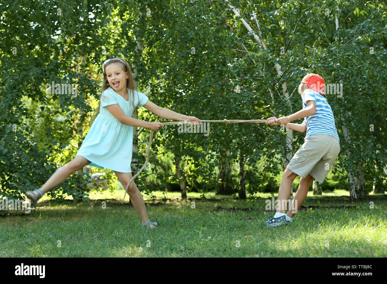 Happy active children playing in park Stock Photo - Alamy