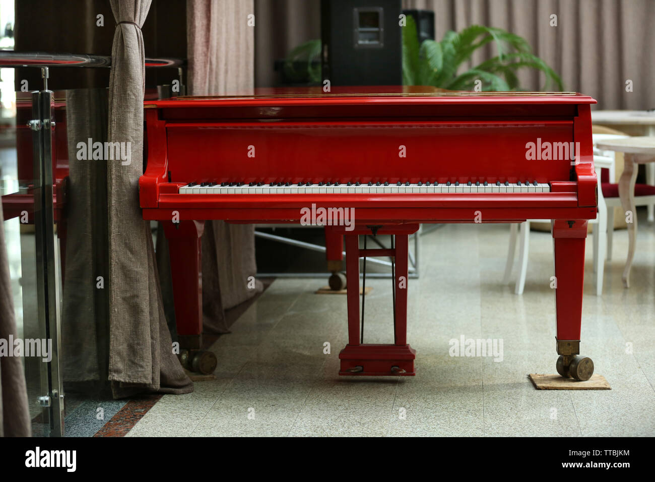 Beautiful red grand piano indoor Stock Photo - Alamy