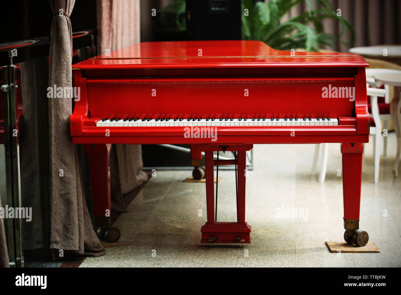 Beautiful red grand piano indoor Stock Photo - Alamy