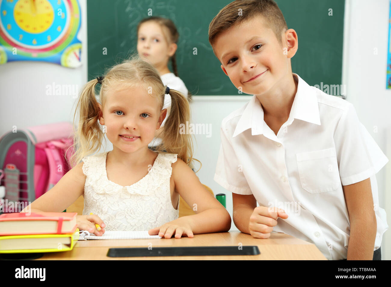 Portrait of happy pupils at lesson Stock Photo - Alamy