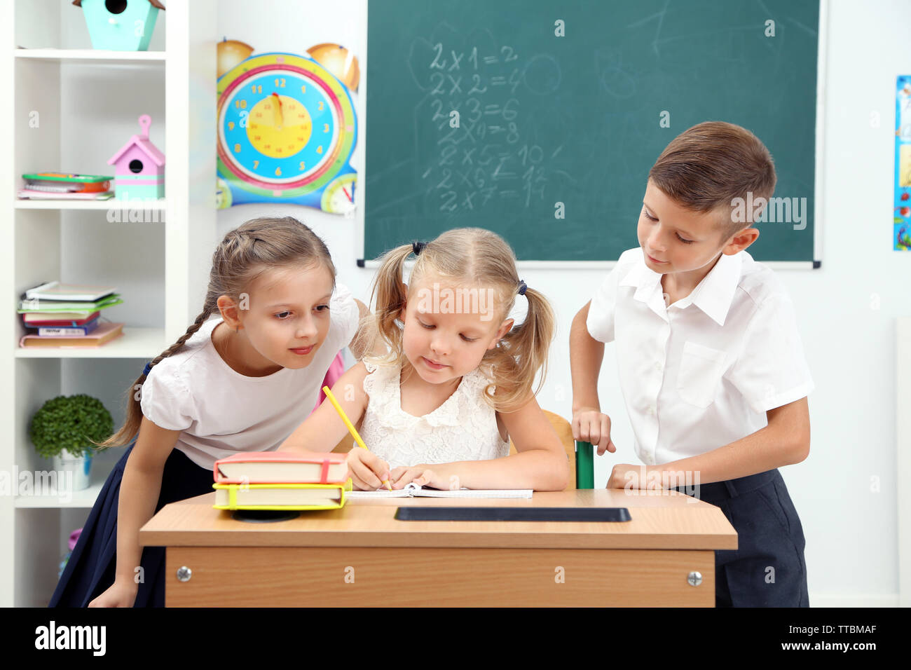Portrait of happy pupils at lesson Stock Photo - Alamy