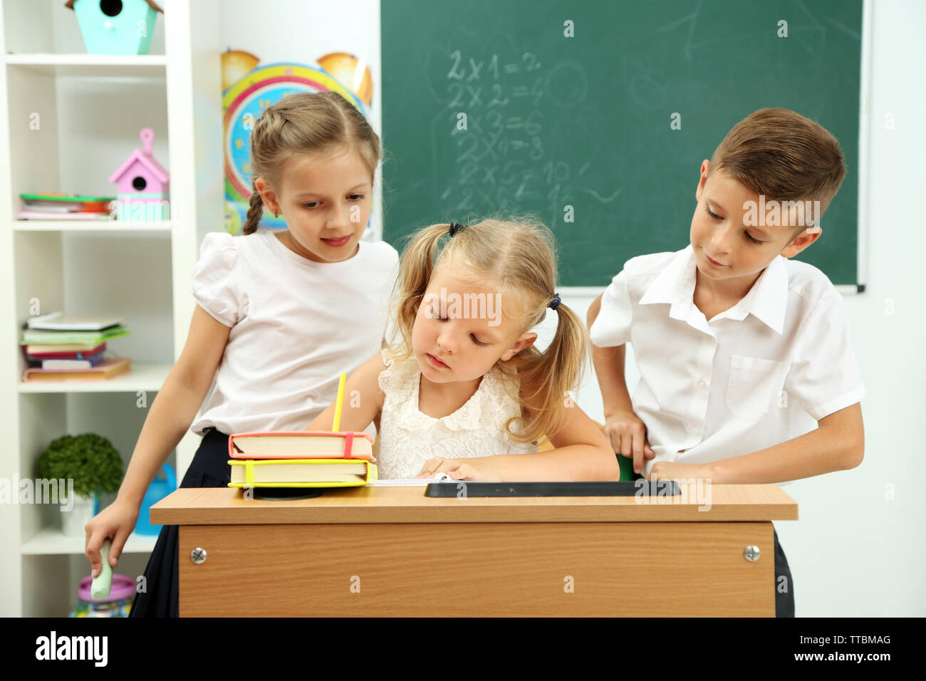 Portrait of happy pupils at lesson Stock Photo - Alamy