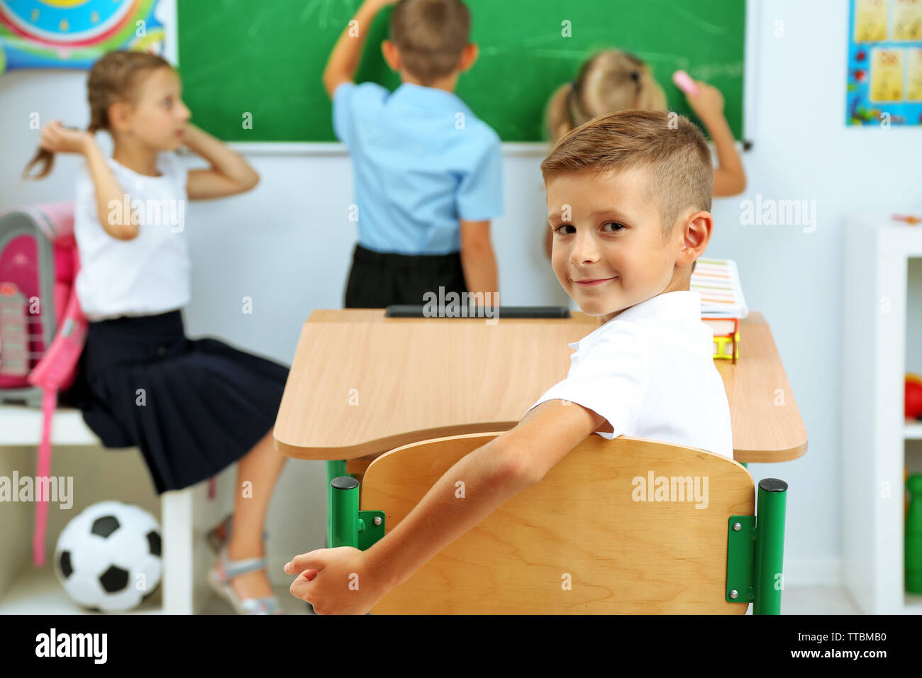 Portrait of happy pupil at lesson Stock Photo - Alamy