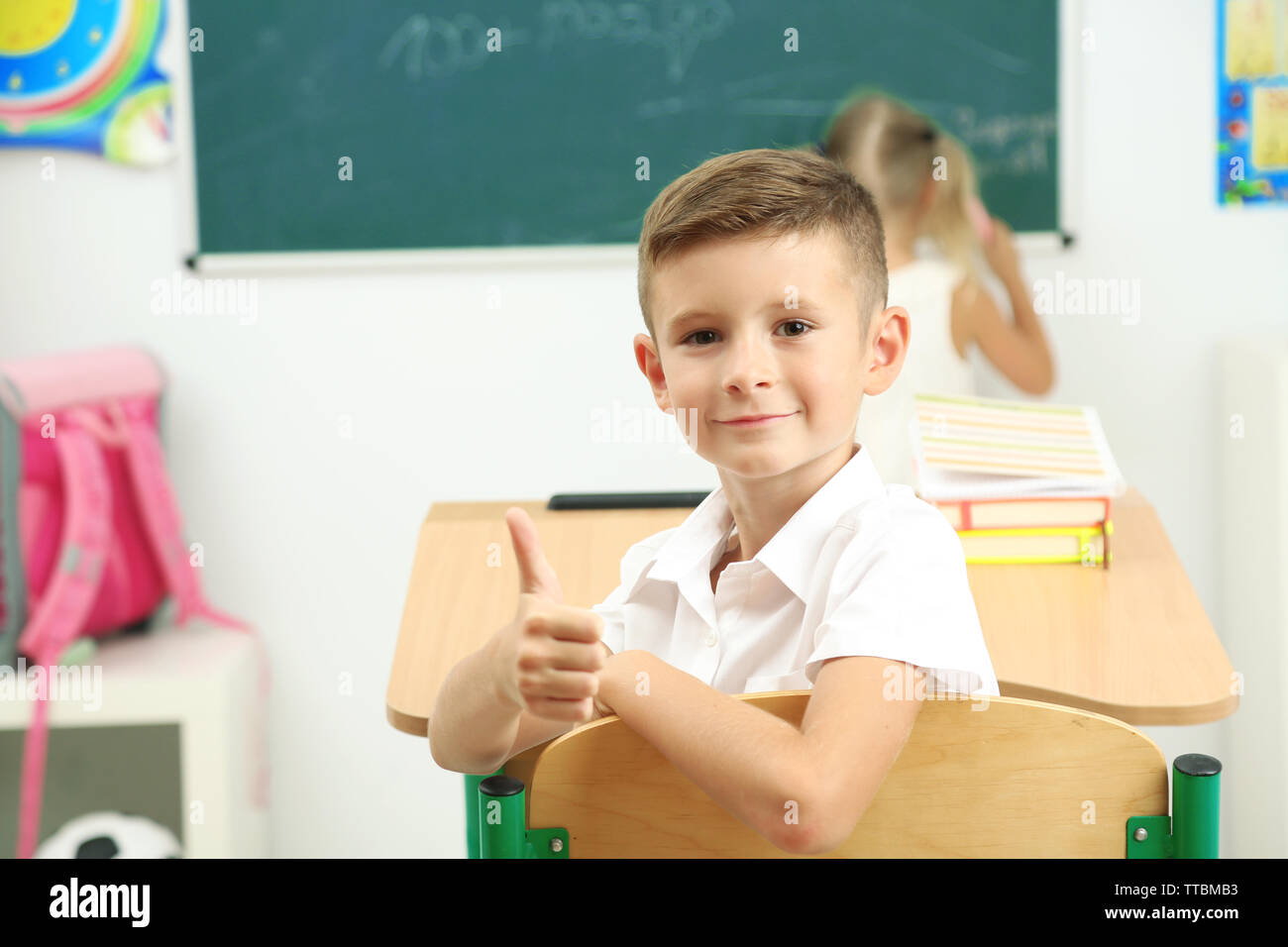 Portrait of happy pupil at lesson Stock Photo - Alamy