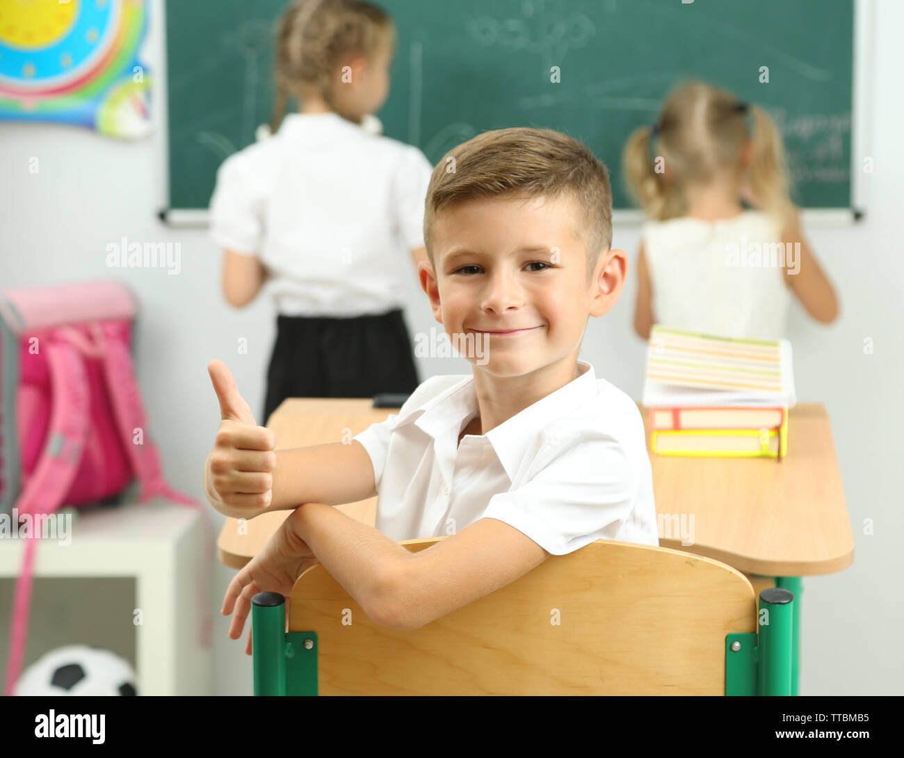 Portrait of happy pupil at lesson Stock Photo - Alamy