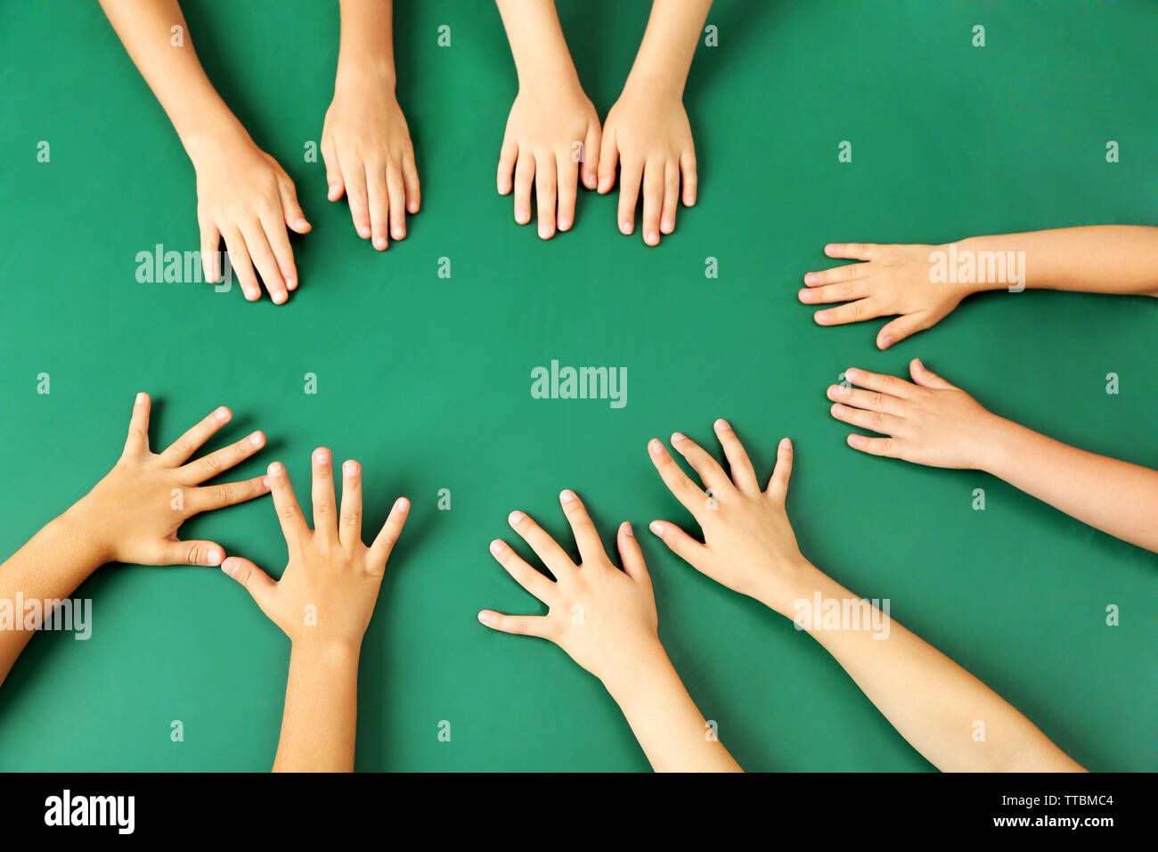 Children hands on blackboard background Stock Photo - Alamy