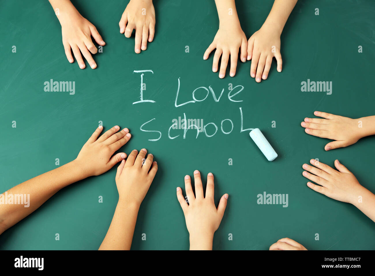 Children hands on blackboard background Stock Photo - Alamy