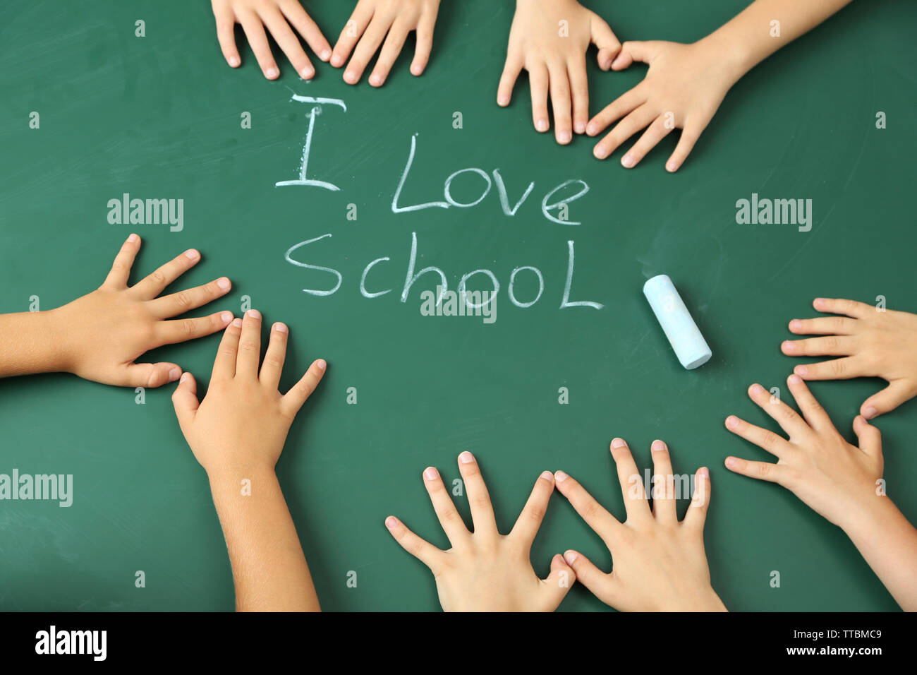Children hands on blackboard background Stock Photo - Alamy