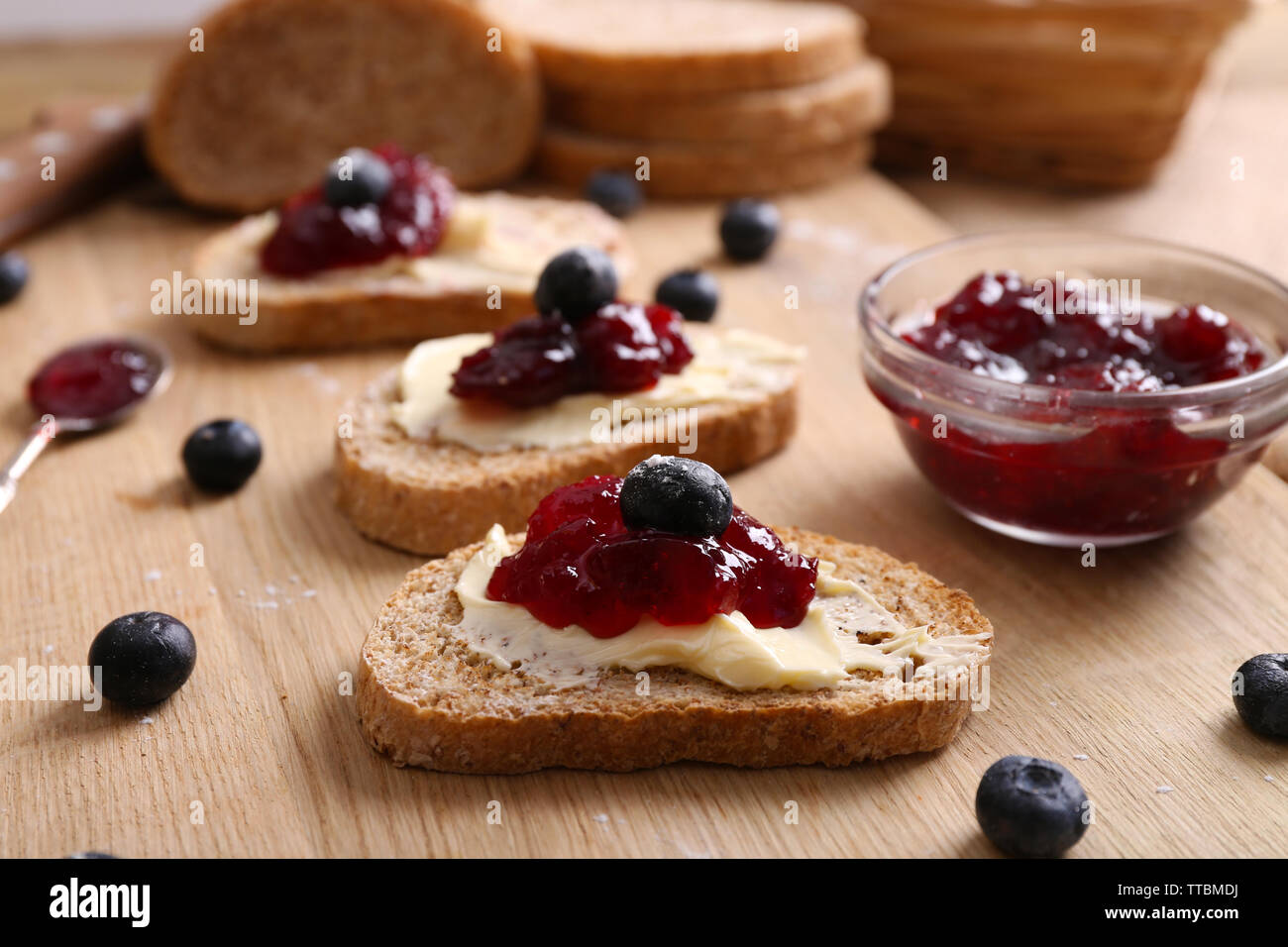 Fresh toast with butter and jam on table close up Stock Photo - Alamy