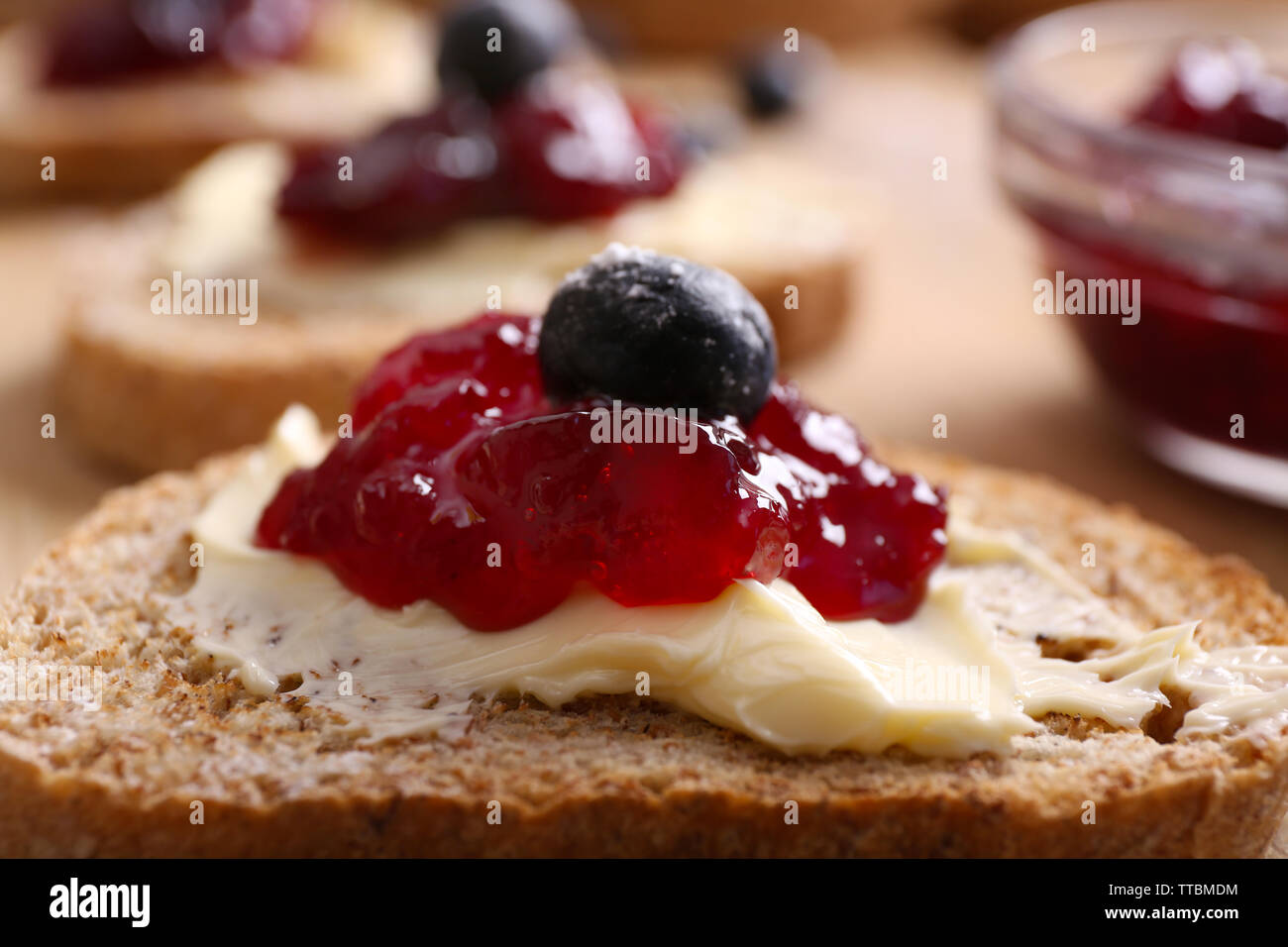 Fresh toast with butter and jam on table close up Stock Photo - Alamy