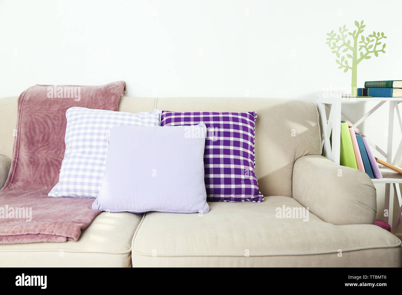 Colorful pillows on sofa, close-up Stock Photo - Alamy