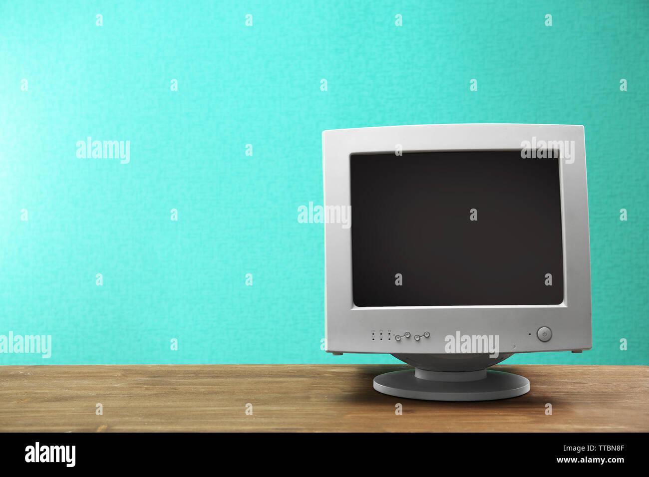 Obsolete computer set on light blue background Stock Photo - Alamy