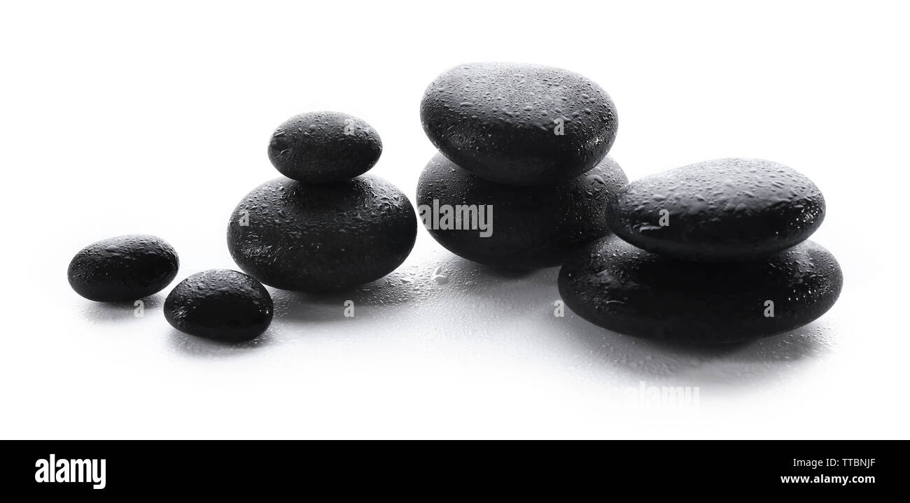 Wet spa stones isolated on white Stock Photo - Alamy