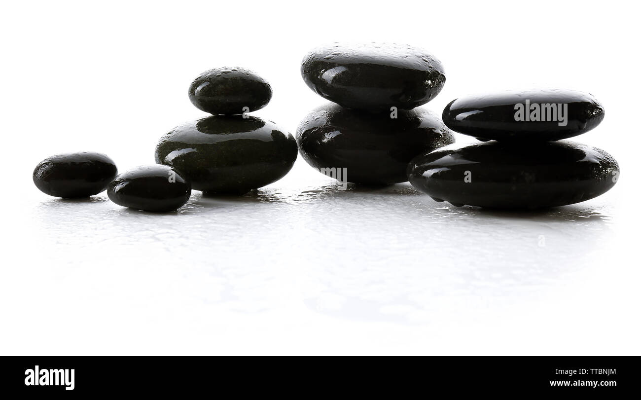 Wet spa stones isolated on white Stock Photo - Alamy