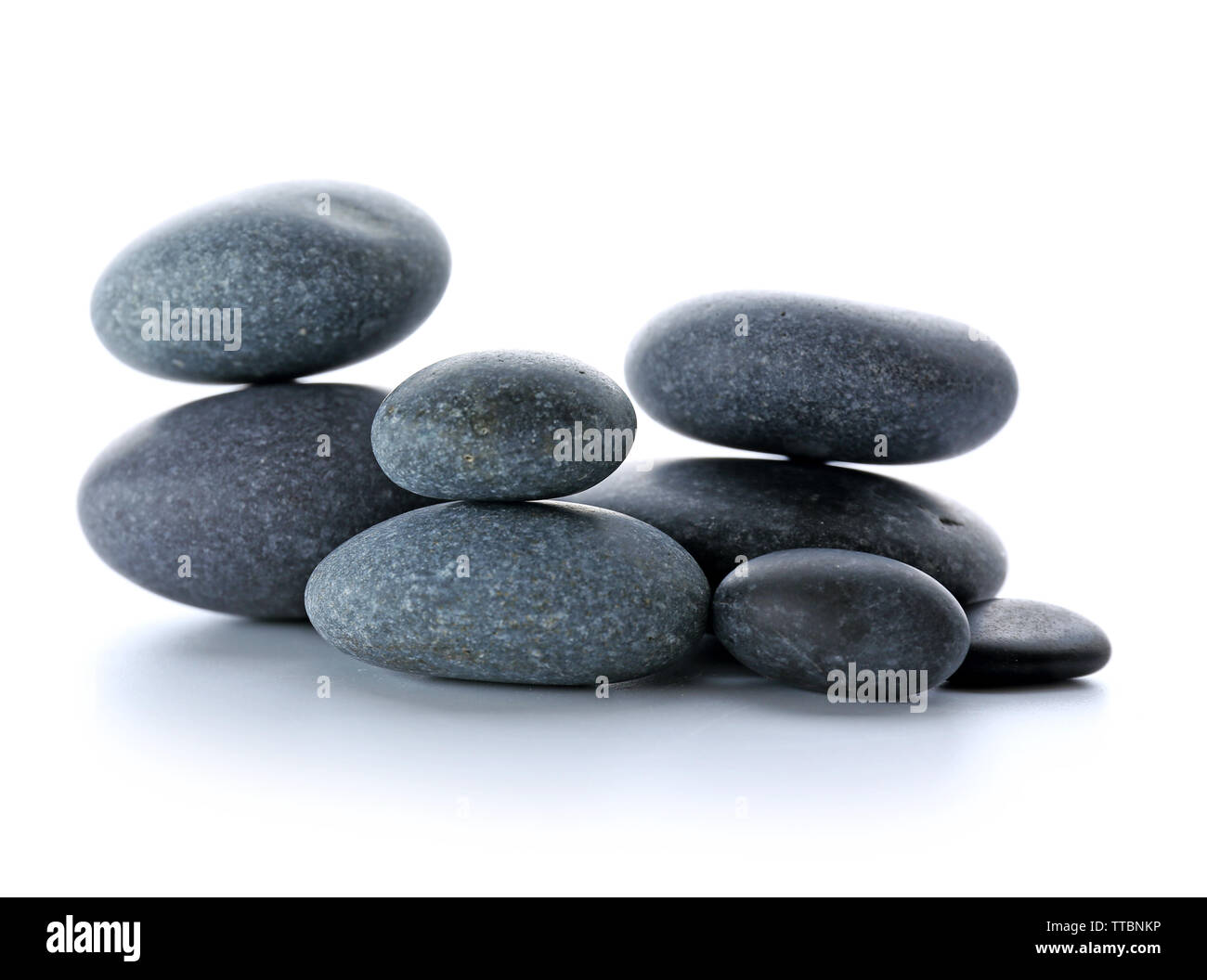 Spa stones isolated on white Stock Photo - Alamy
