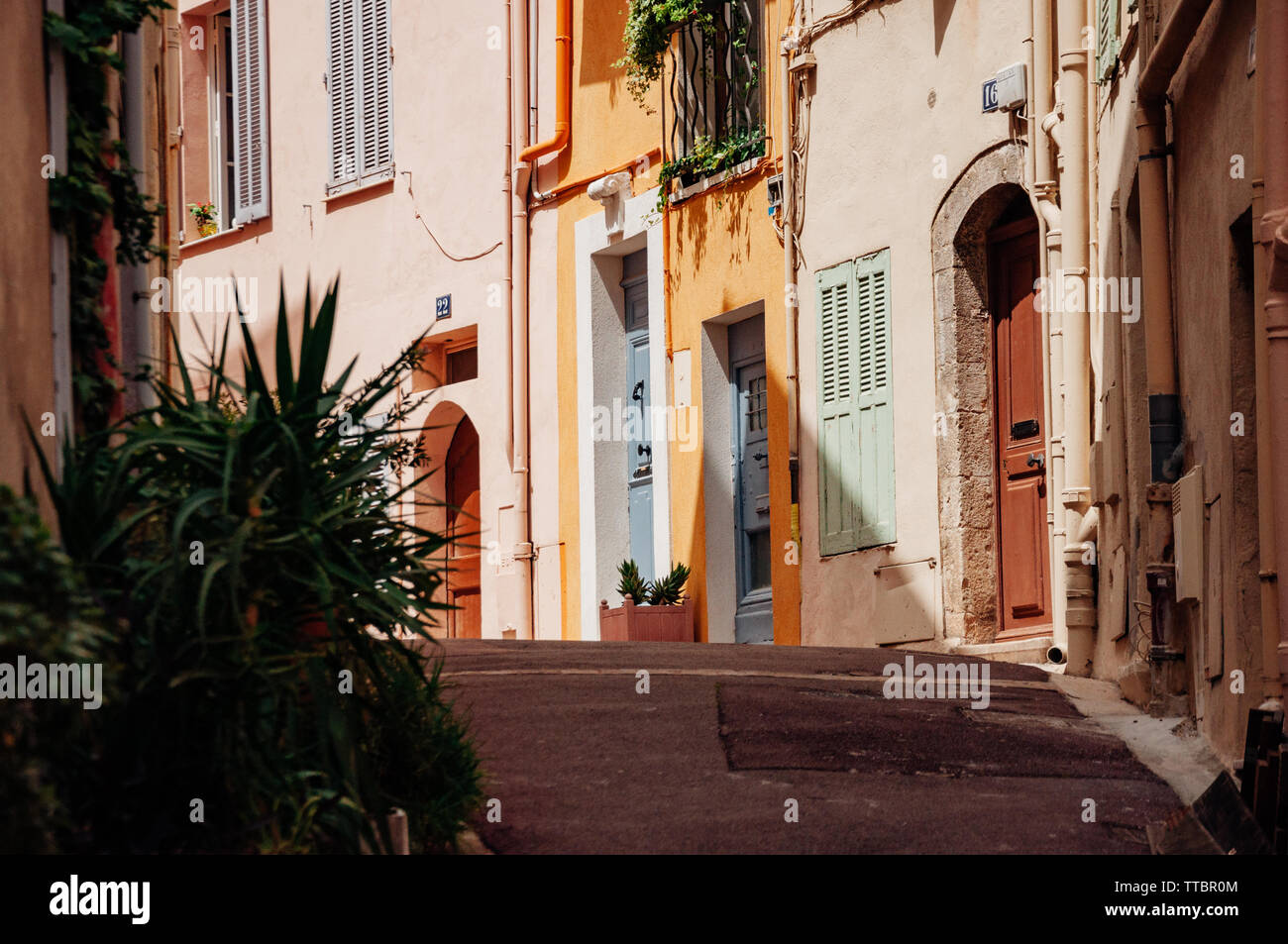 Street with colorful doors in the oldtown of Cannes, France Stock Photo ...
