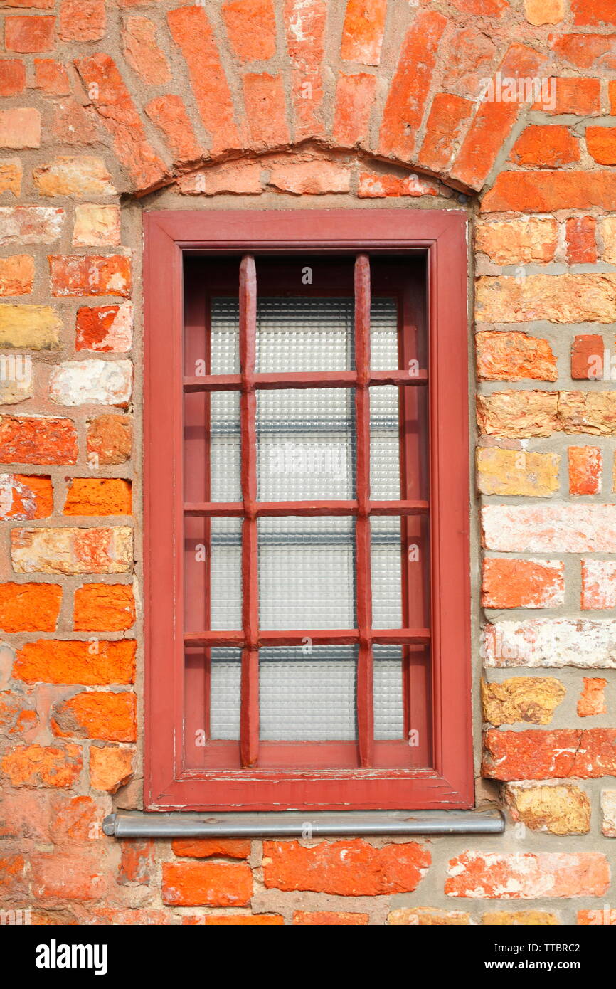 Old window with brick house wall and window bars Stock Photo - Alamy