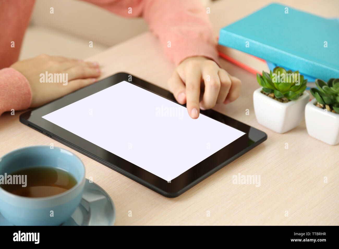Woman using PC tablet at home Stock Photo - Alamy