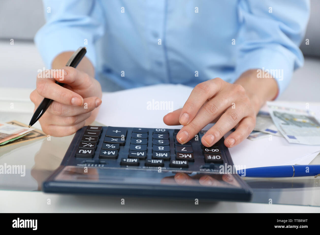 Accounting concept.Analyzing finance report with calculator Stock Photo ...
