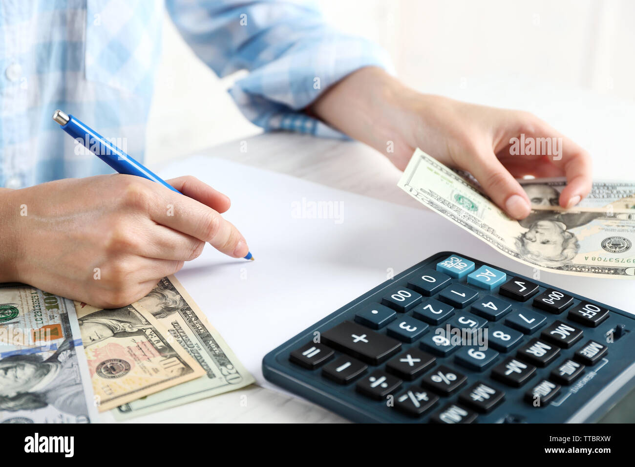 Accounting concept.Analyzing finance report with calculator Stock Photo ...