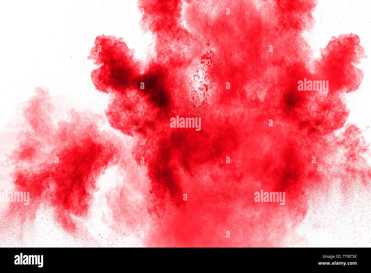 Abstract red dust splattered on white background. Red powder explosion ...