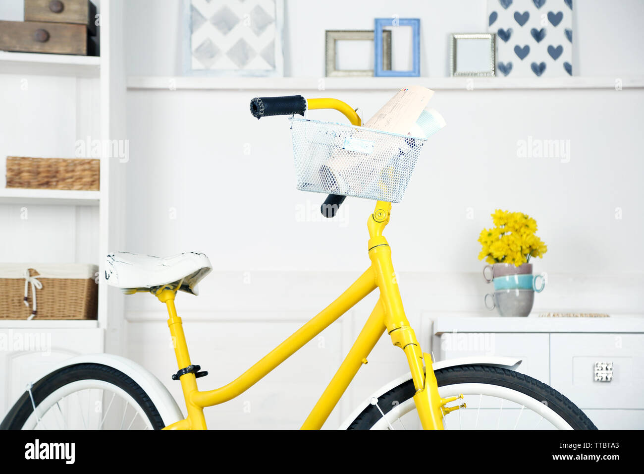 Yellow retro bicycle in spacious bright room Stock Photo - Alamy