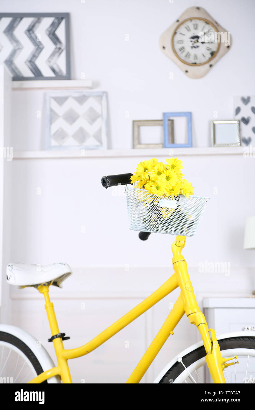 Yellow retro bicycle in spacious bright room Stock Photo - Alamy