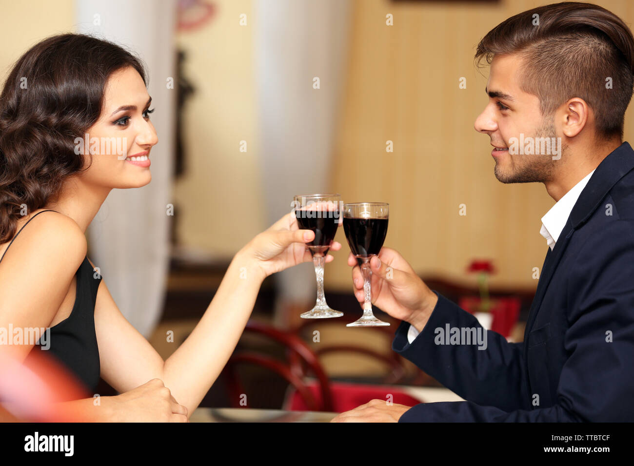 couple in love cheers at the restaurant Stock Photo - Alamy