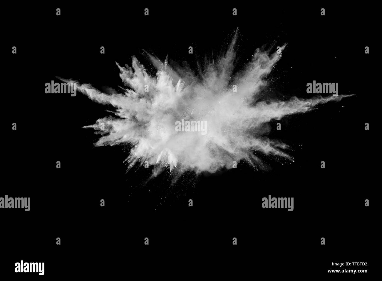 White powder explosion.Freeze motion of white dust particles on black ...
