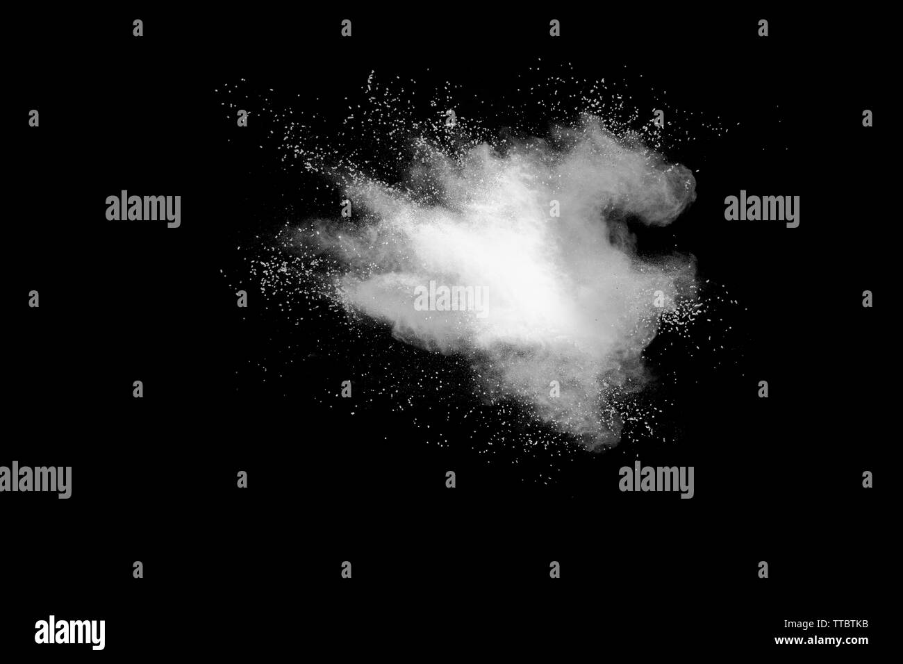 White powder explosion.Freeze motion of white dust particles on black ...