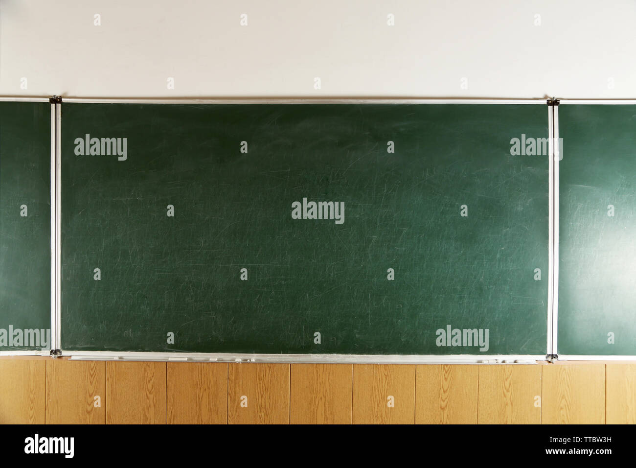 Blackboard on wall, close up Stock Photo - Alamy