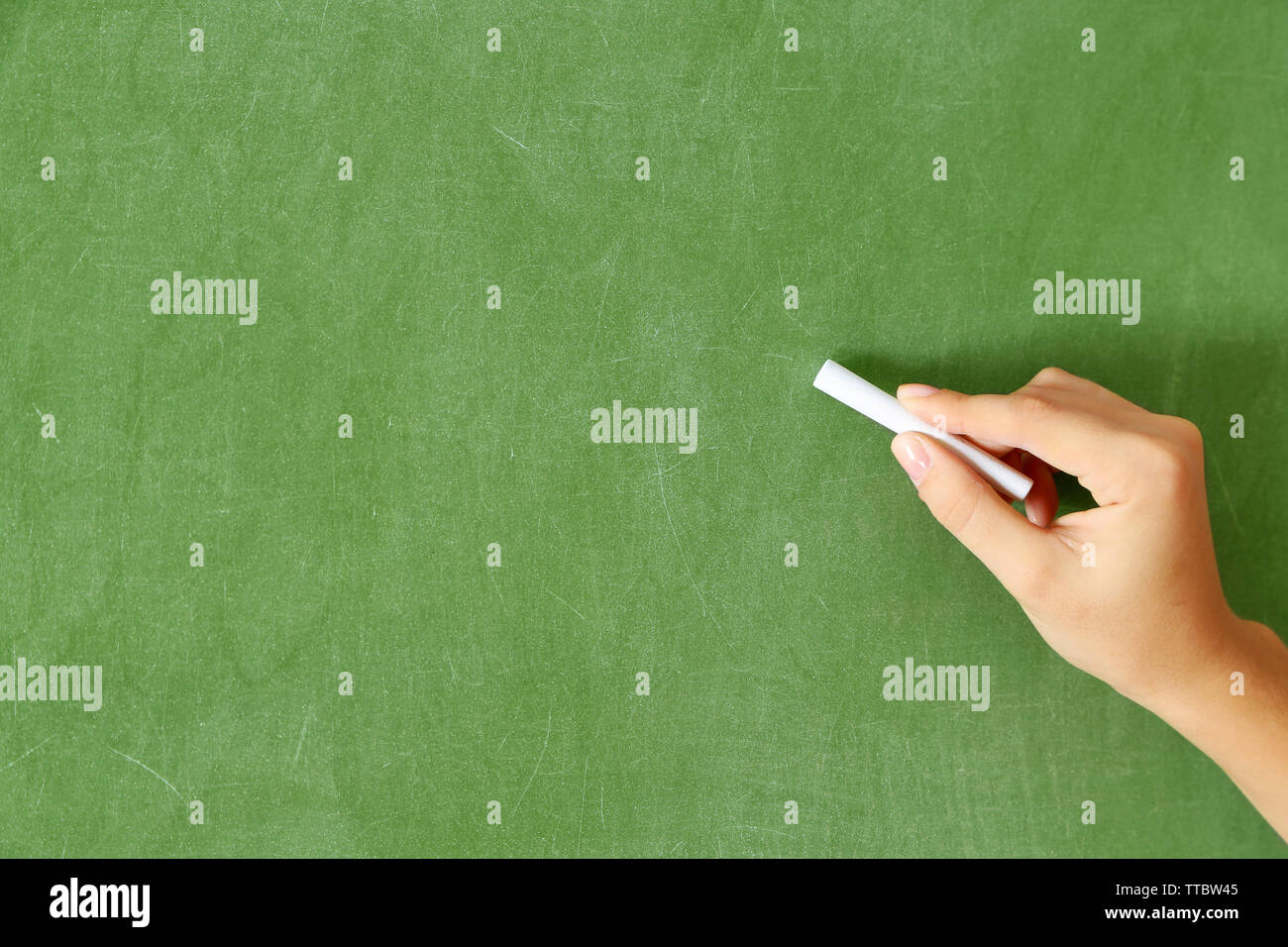 Female hand writing on blackboard with chalk, close up Stock Photo - Alamy