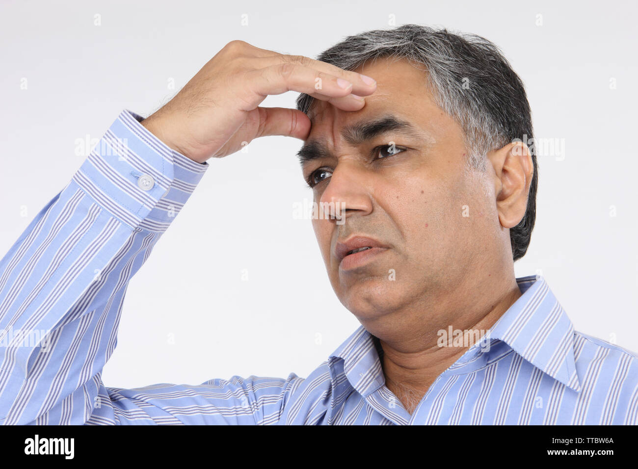 Indian senior man suffering from headache Stock Photo - Alamy
