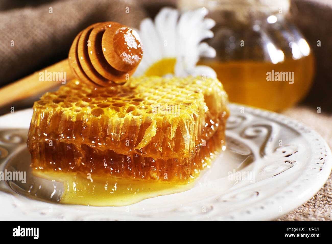 Honey products on plate closeup Stock Photo - Alamy