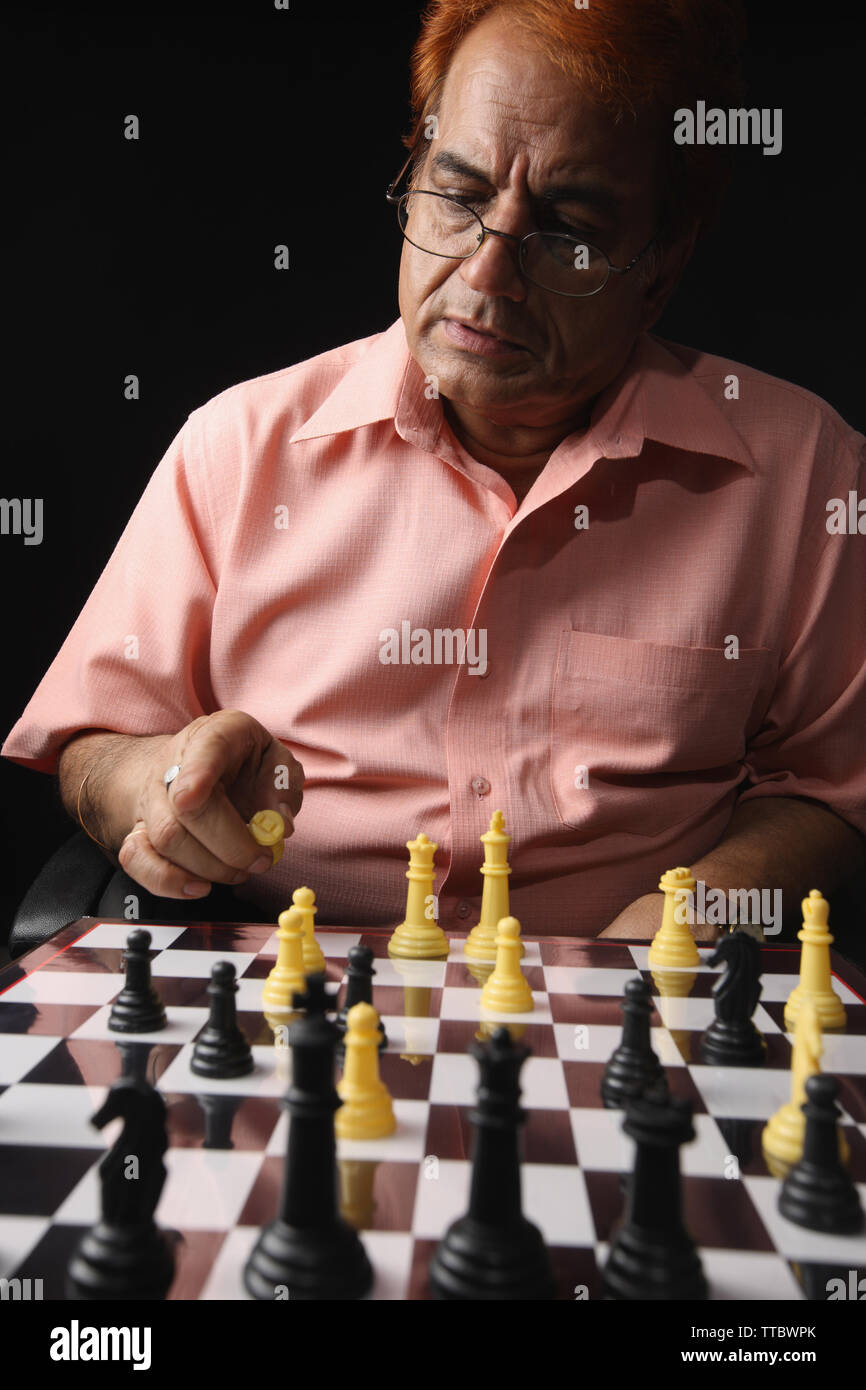 Man playing chess Stock Photo - Alamy