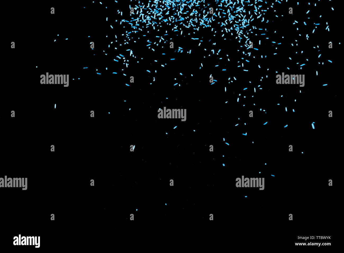 Blue falling particles round shape on black backround Stock Photo - Alamy