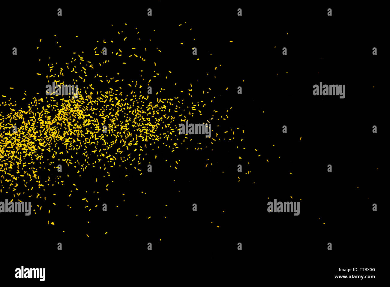 Yellow falling particles round shape on black backround Stock Photo - Alamy