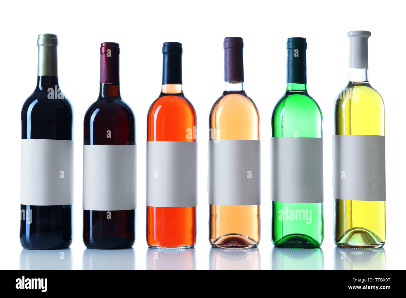 wine bottles in a row isolated on white background Stock Photo - Alamy