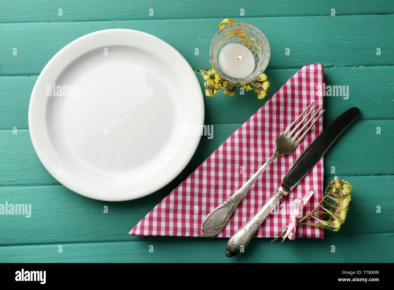 Summer table setting on color wooden background Stock Photo - Alamy