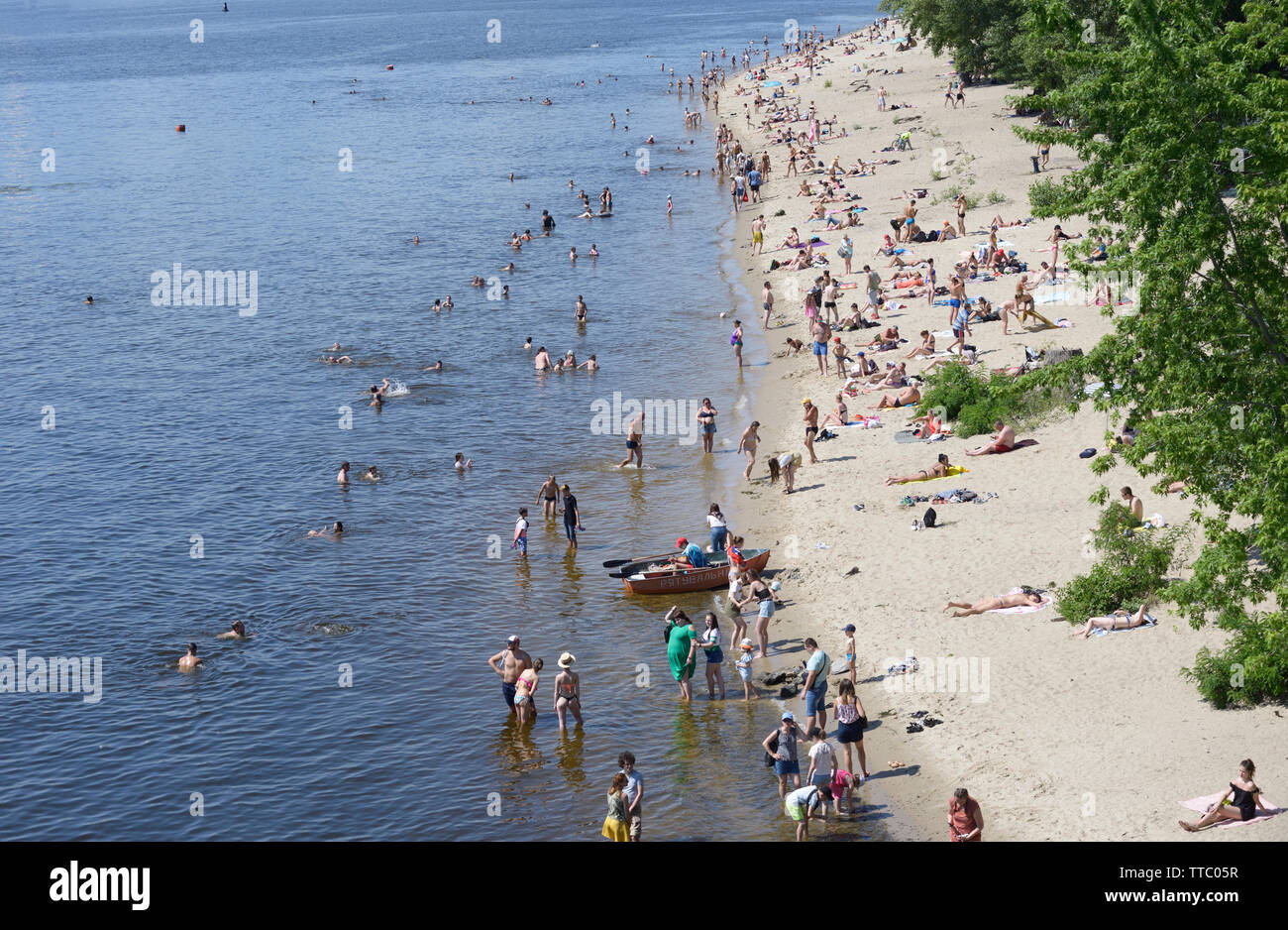 People sunbathing on a beach of the Dnieper river. June 25, 2019 ...