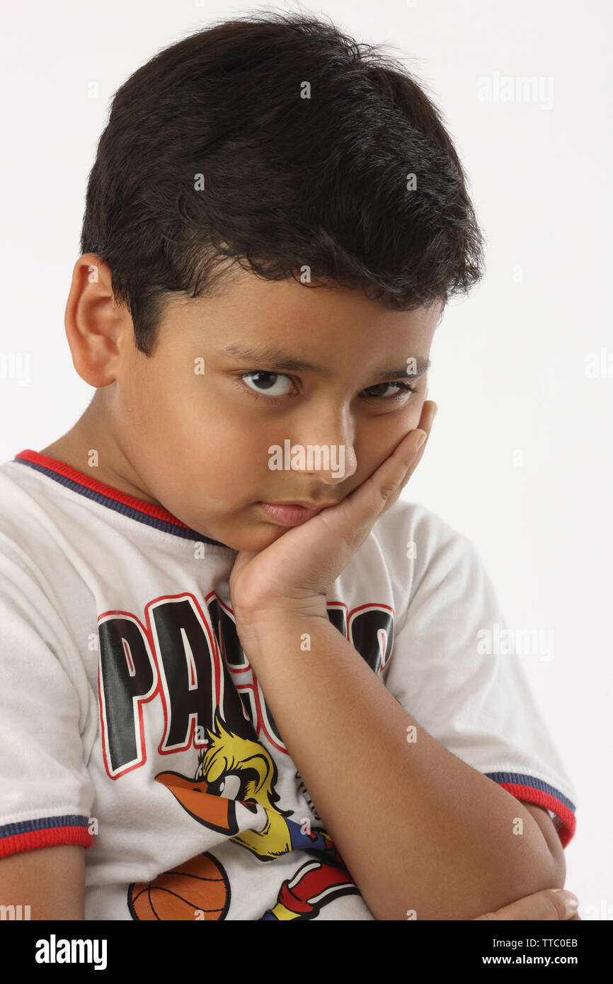 Portrait of a boy thinking Stock Photo - Alamy